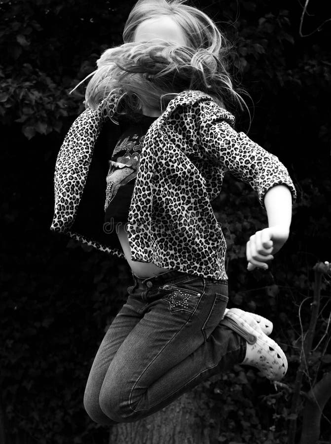 Child jumping in mid air stock photo. Image of action - 42848996