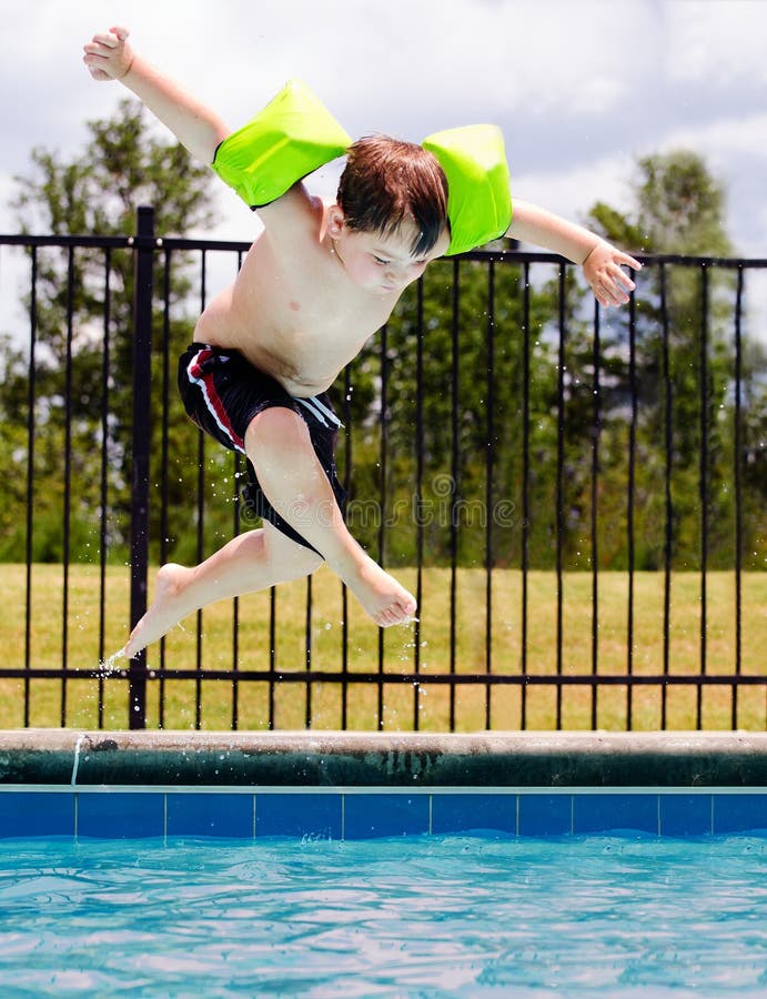 Child jumping into pool stock image. Image of child, entertainment ...