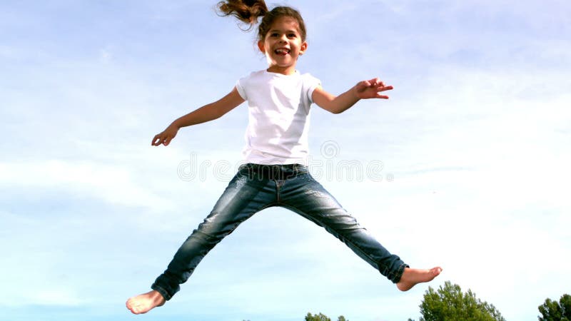 Child Jumping Barefoot on Concrete Surface during Outdoor Playtime ...