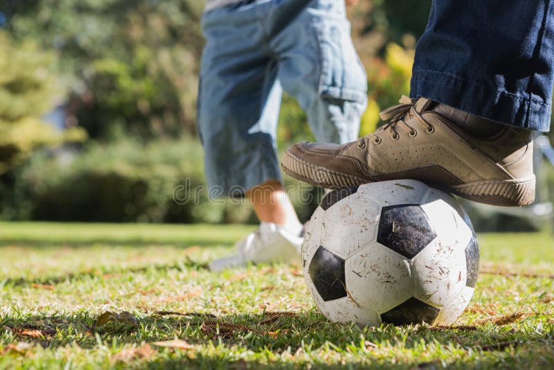 Child kicking the ball stock photo. Image of parent, park - 32515820