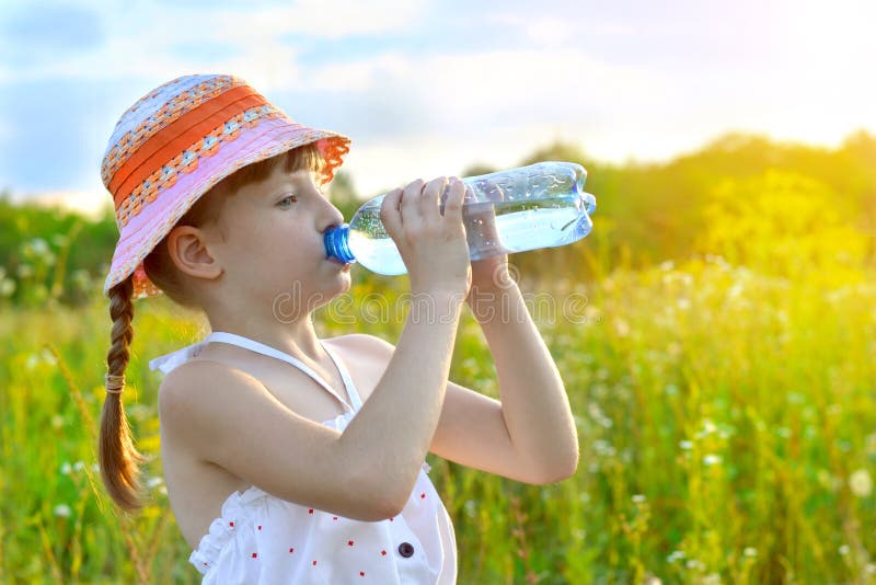Little Girl Drinks Water from a Plastic Bottle Stock Photo - Image of ...
