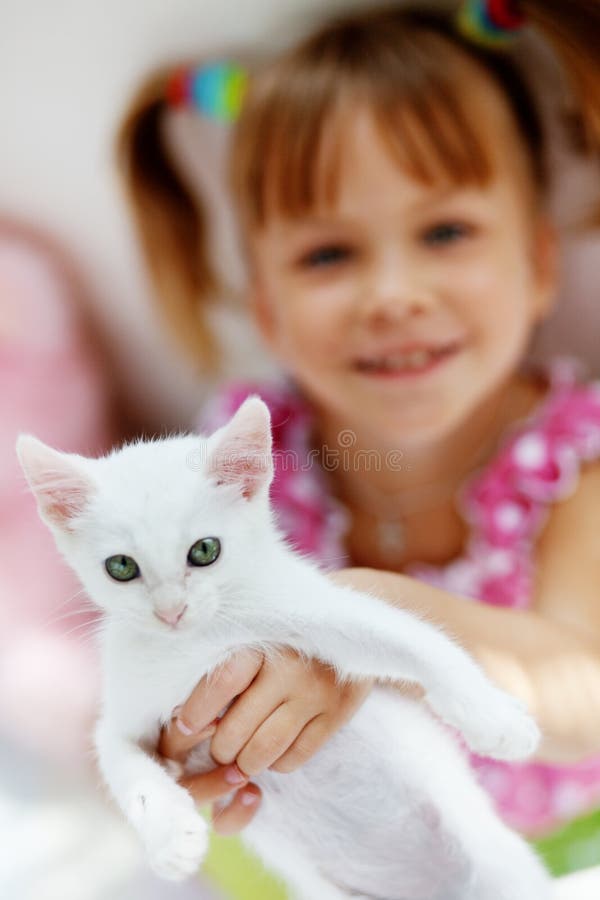 Child with kitty stock image. Image of love, little, eyes - 10377577