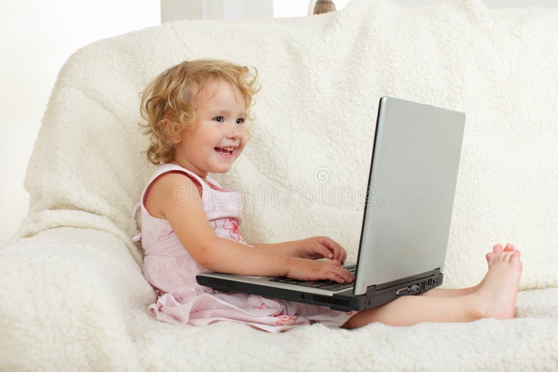 Child with laptop stock photo. Image of living, baby - 12591352