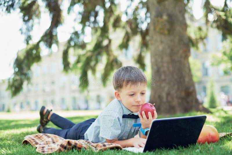 Group of Elementary School Children Working Together on Nature at Park ...