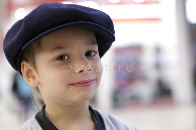 Child in large cap stock image. Image of lifestyle, smiling - 79250519