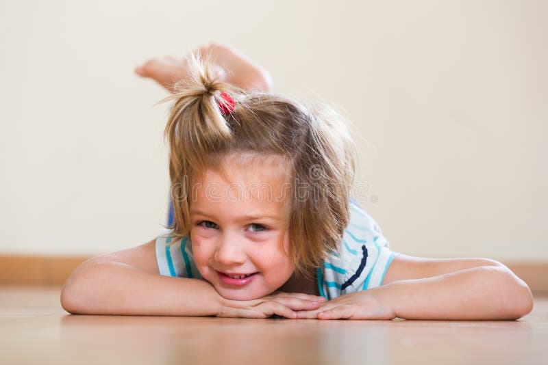 Child laying at floor stock image. Image of home, people - 49974323