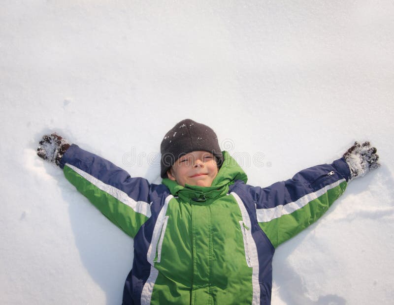 Child laying on snow stock image. Image of light, outdoors - 11145959