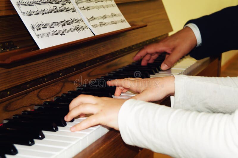 Child Learning Music on a Keyboard with a Teacher Stock Photo - Image ...