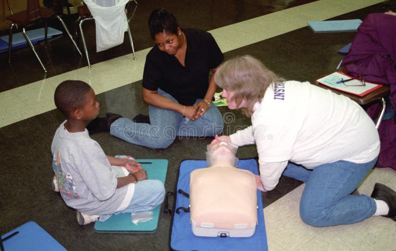 Child and Learning CPR at a Community Center Editorial Image - Image of ...