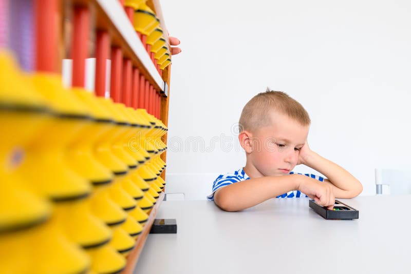 Child with Learning Difficulty in Occupational Therapy. a Boy Doing ...