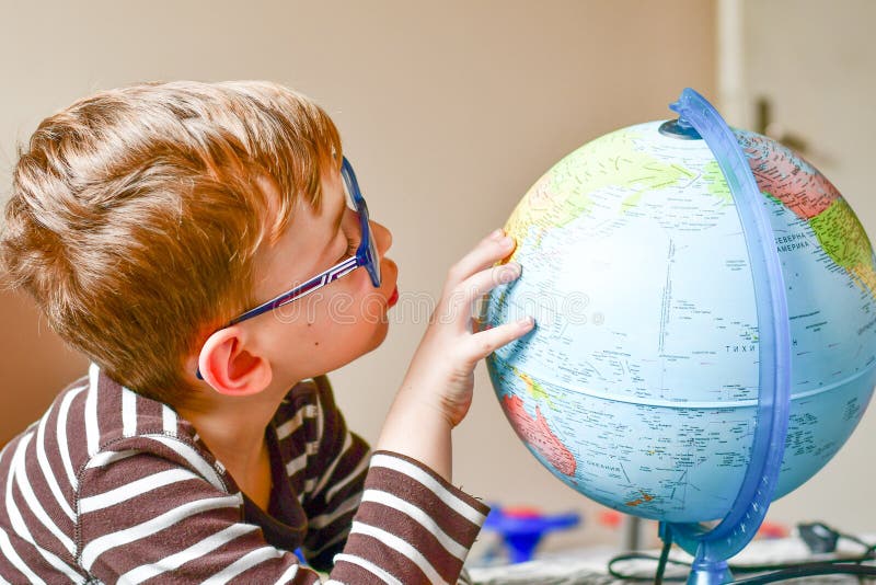 Child Learning Geography with Globe at Home Stock Image - Image of ...