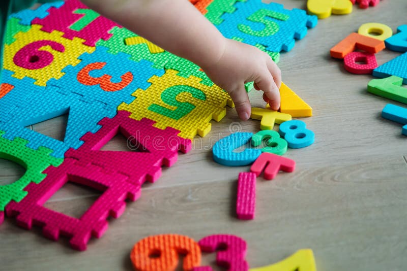 Child Learning Numbers and Math, Kid Playing Puzzle Stock Image - Image ...