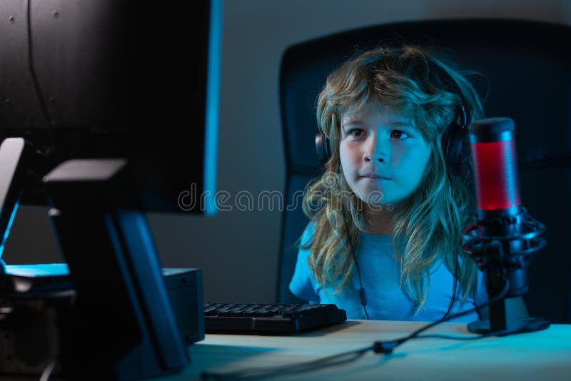 Child Learning Online at Night, Using Desktop Computer in Living Room ...