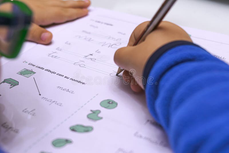 Child Learning To Write and Doing Homework at School Stock Photo ...