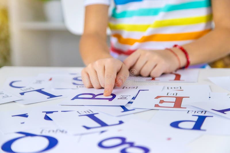 The Child Learns English Letters. Selective Focus Stock Photo - Image ...