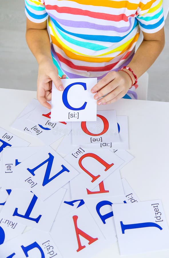 The Child Learns English Letters. Selective Focus Stock Image - Image ...
