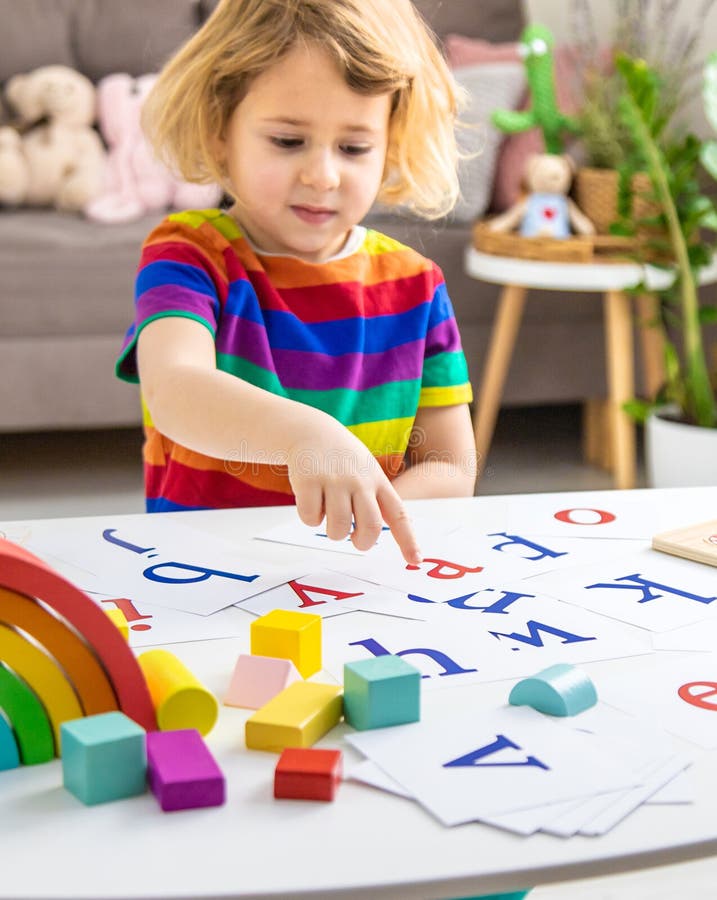 Child Learns Numbers and Letters. Selective Focus Stock Photo - Image ...