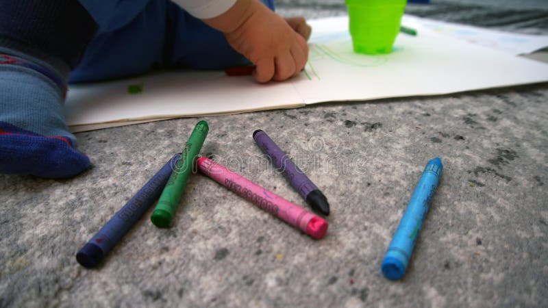 The Child Learns To Draw Wax Crayons on the Floor Stock Image - Image ...