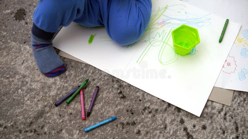 The Child Learns To Draw Wax Crayons on the Floor Stock Image - Image ...