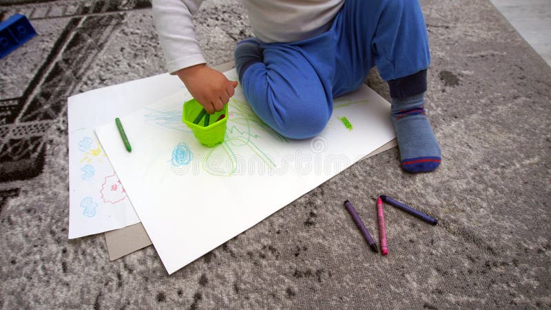 The Child Learns To Draw Wax Crayons on the Floor Stock Image - Image ...