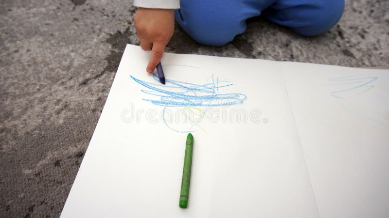 The Child Learns To Draw Wax Crayons on the Floor Stock Photo - Image ...
