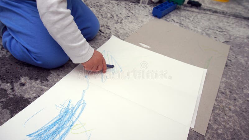 The Child Learns To Draw Wax Crayons on the Floor Stock Photo - Image ...