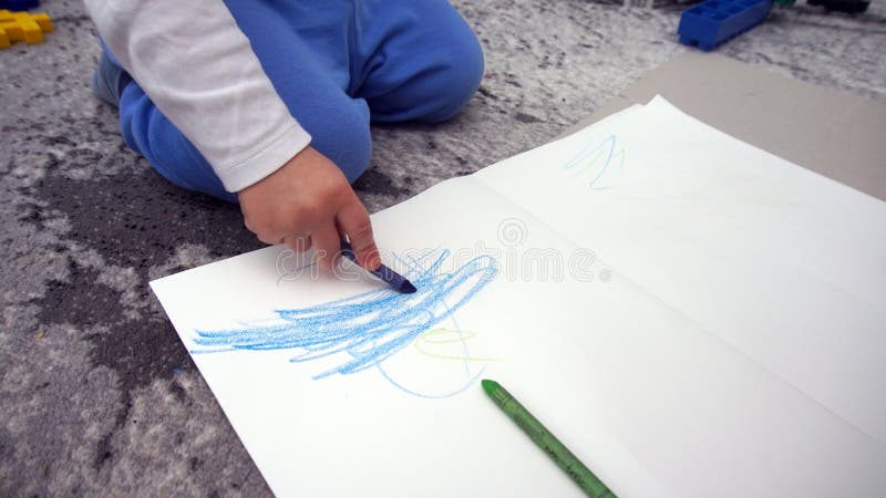 The Child Learns To Draw Wax Crayons on the Floor Stock Photo - Image ...