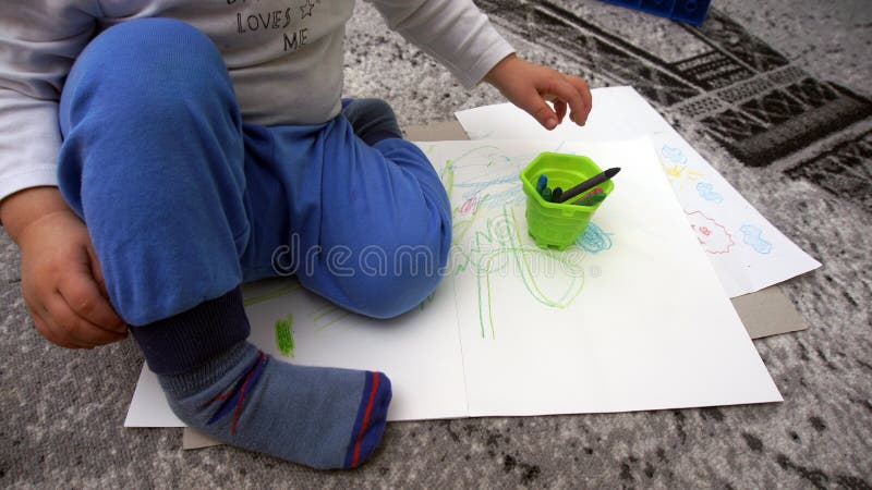 The Child Learns To Draw Wax Crayons on the Floor Stock Image - Image ...