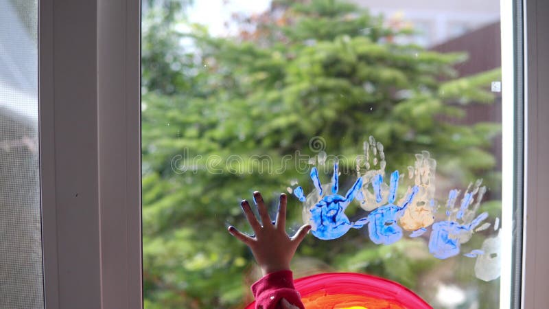 Child Leaves a Handprint with Paint on the Window Stock Image - Image ...