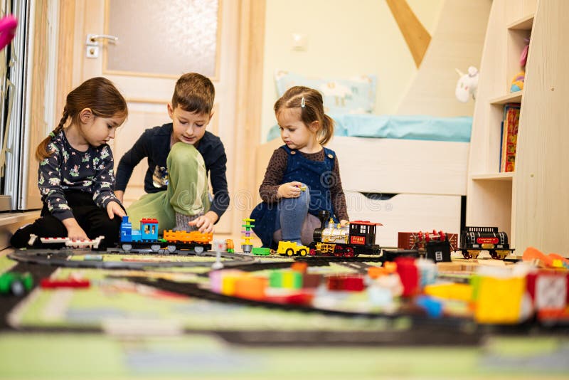 Child Leisure Activity, Creative Game. Kids Play at Home with Toy Train ...