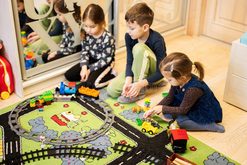 Child Leisure Activity, Creative Game. Kids Play at Home with Toy Train ...