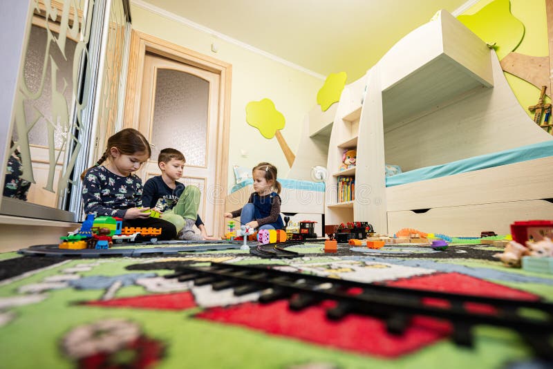 Child Leisure Activity, Creative Game. Kids Play at Home with Toy Train ...