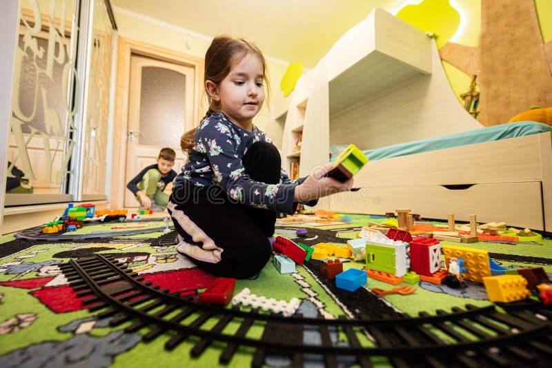 Child Leisure Activity, Creative Game. Kids Play at Home with Toy Train ...