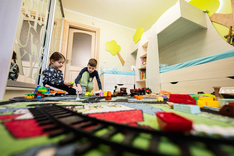 Child Leisure Activity, Creative Game. Kids Play at Home with Toy Train ...