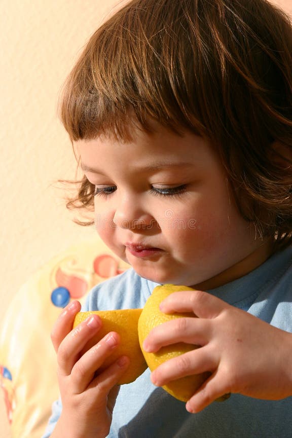 Child and lemons stock image. Image of peckish, nutrition - 2060965