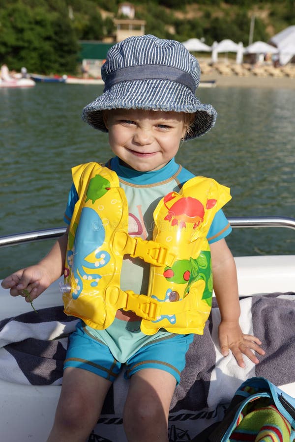 Child in life jacket stock photo. Image of enjoyment - 96774988