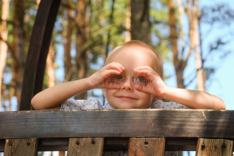 Child Looking into His Hands Like through Binoculars Stock Photo ...