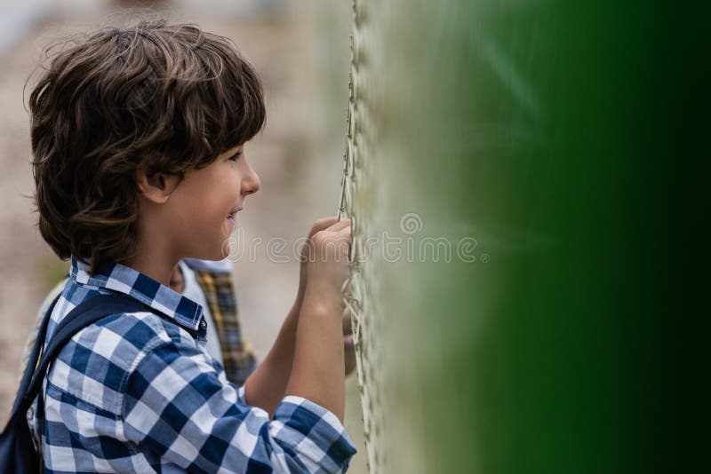 Child looking through net stock image. Image of smile - 103919503