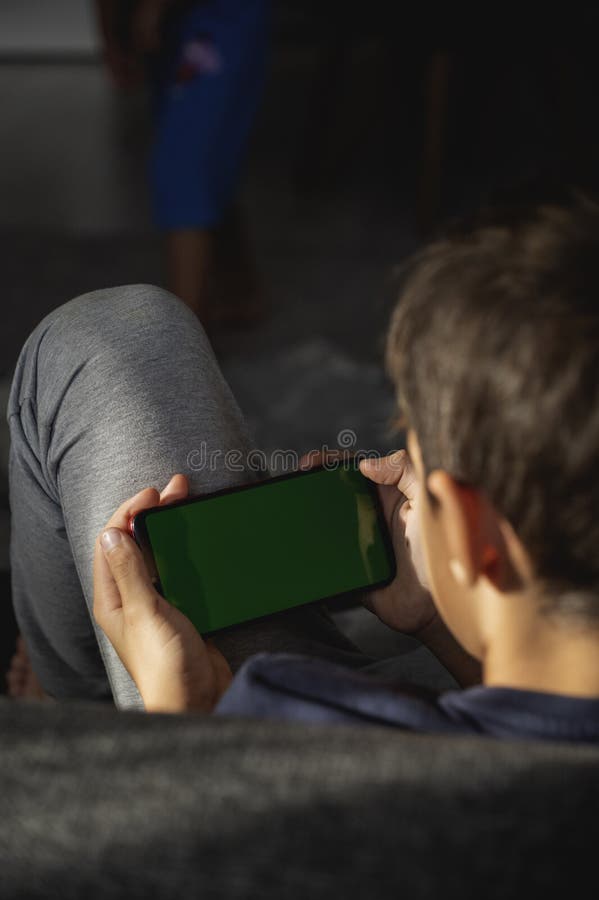 Child Looking at Phone Screen. Focus on Phone Stock Image - Image of ...