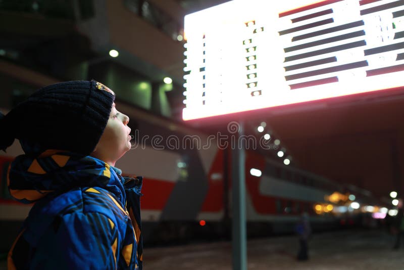 Child Looking At Train Schedule Stock Image - Image of schedule, time ...