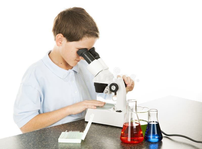 Portrait of Pupil Using Microscope in Science Lesson Stock Photo ...