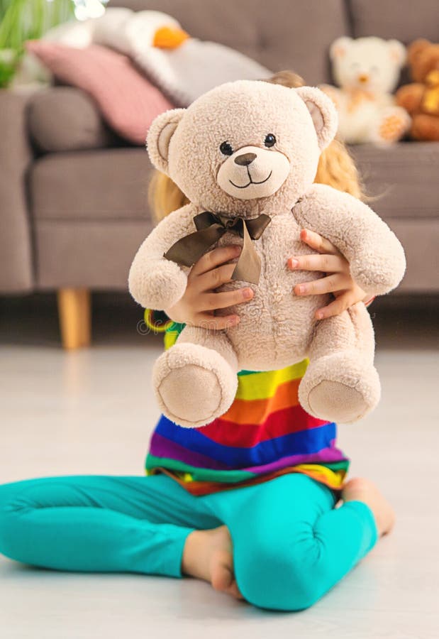 Child Loves Teddy Bear at Home. Selective Focus Stock Image - Image of ...