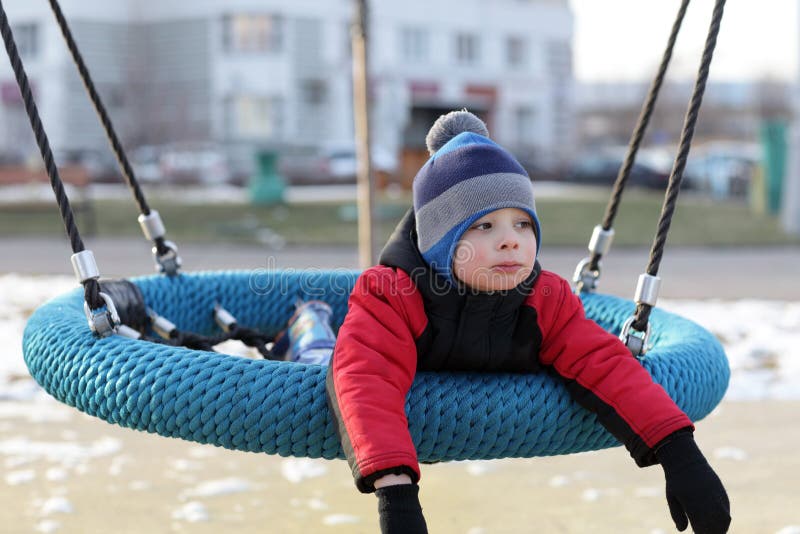 Child lying on a swing stock image. Image of leisure - 53303079