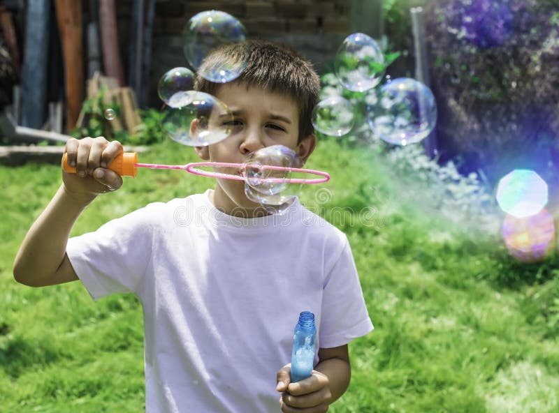 Child makes bubbles stock photo. Image of cute, playful - 42996362