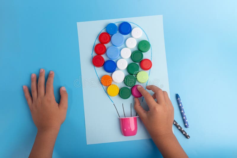 Child Makes a Craft with Plastic Caps, Kid Develops Hands Coordination ...