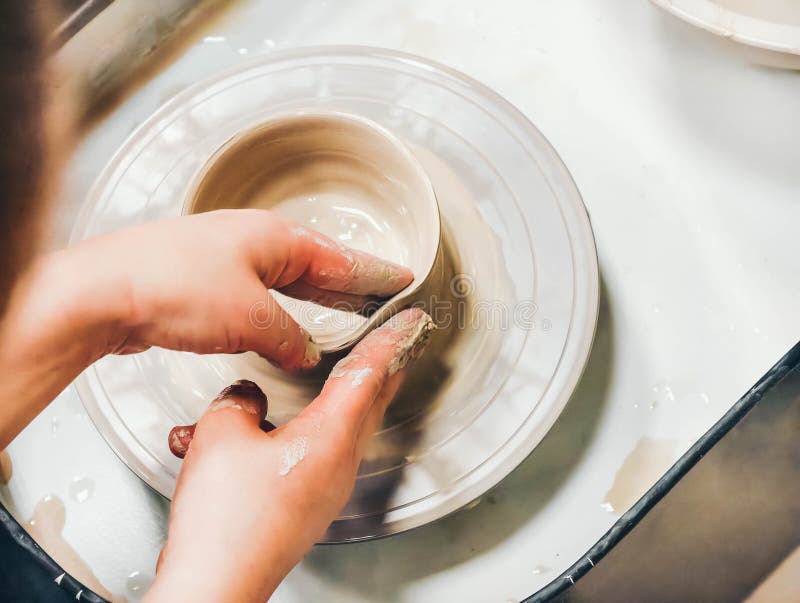 Child Making Ceramic Vase on Rotating Pottery Wheel at Workshop ...