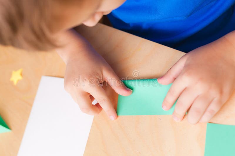 Child Making Christmas Card from Paper. Step 2 Stock Photo - Image of ...