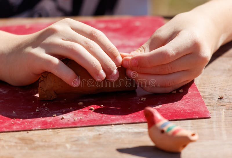 A Child is Making a Clay Bird on a Red Table Stock Photo - Image of ...