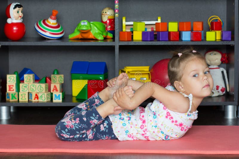 Child Making Exercise Named Boat on Matt Stock Photo - Image of fitness ...