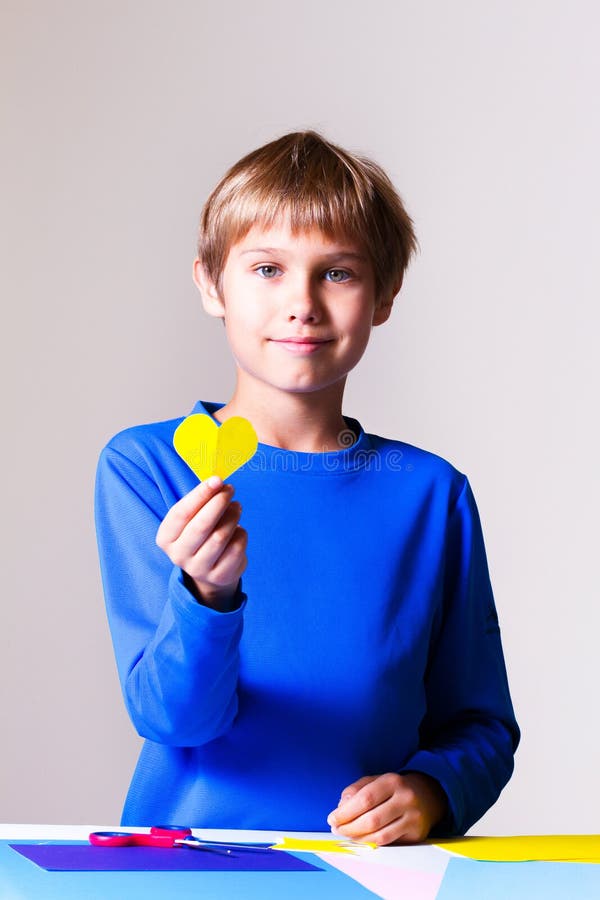 Child Making Greeting Card with Colored Paper at the Table Stock Image ...